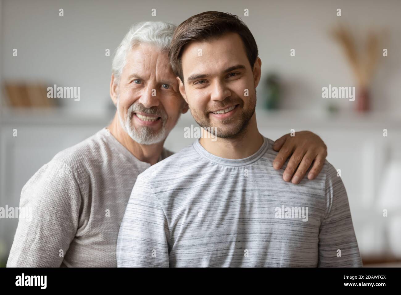 Head shot portrait smiling mature father and adult son hugging Stock ... Head shot portrait smiling mature father and adult son hugging Stock ...