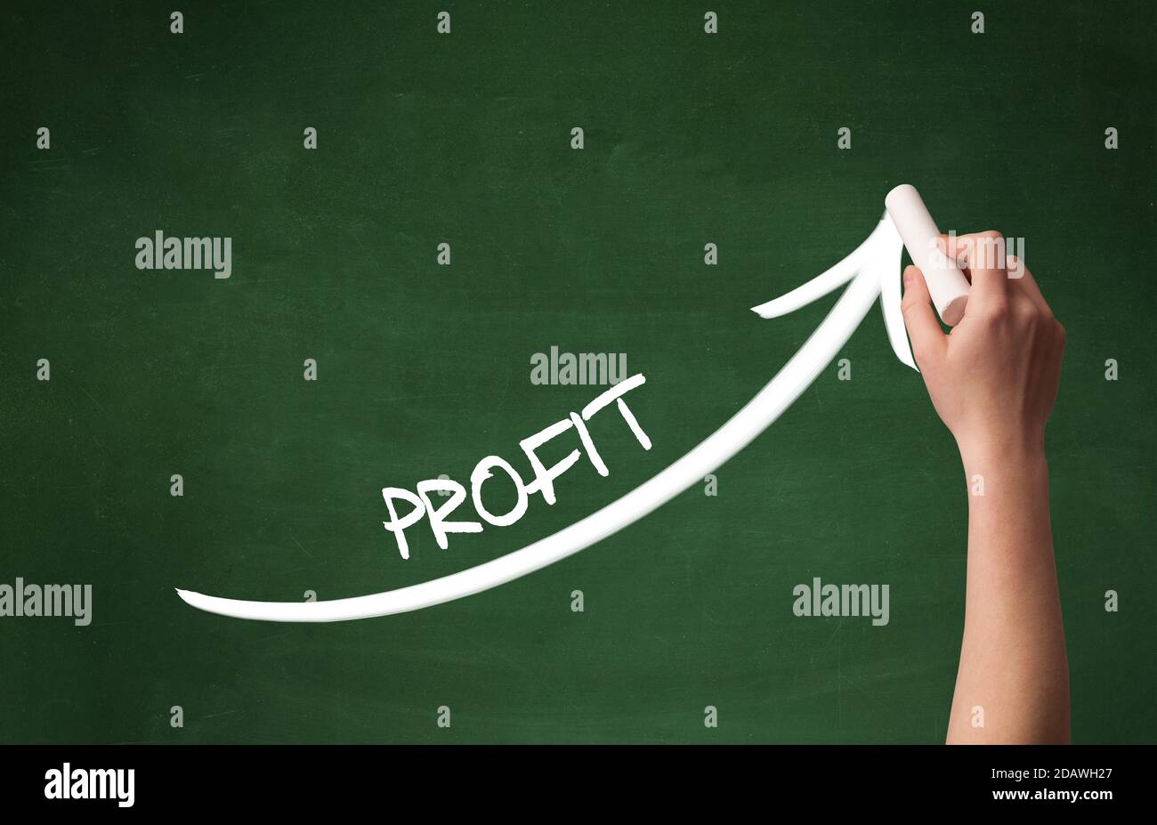 Hand drawing PROFIT inscription with white chalk on blackboard ...