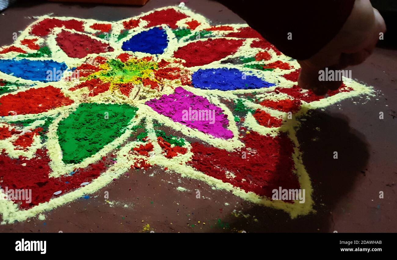 Kathmandu, Nepal. 15th Nov, 2020. A woman prepares colourful Rangoli in ...