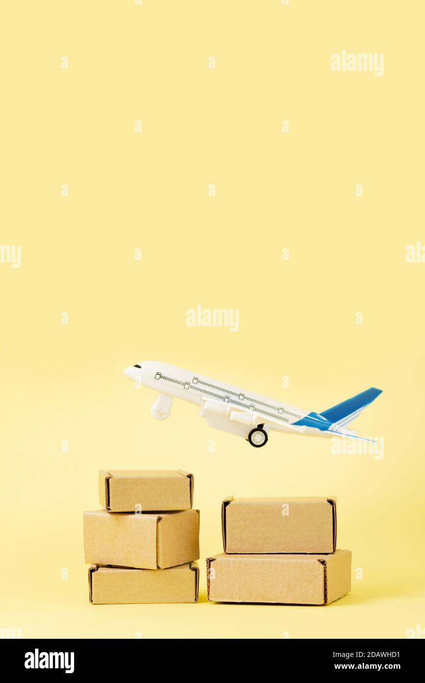 Airplane and stack of cardboard boxes. concept of air cargo and parcels ...