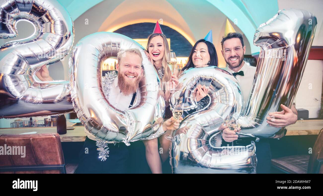 Group of party people celebrating the arrival of 2021 Stock Photo - Alamy