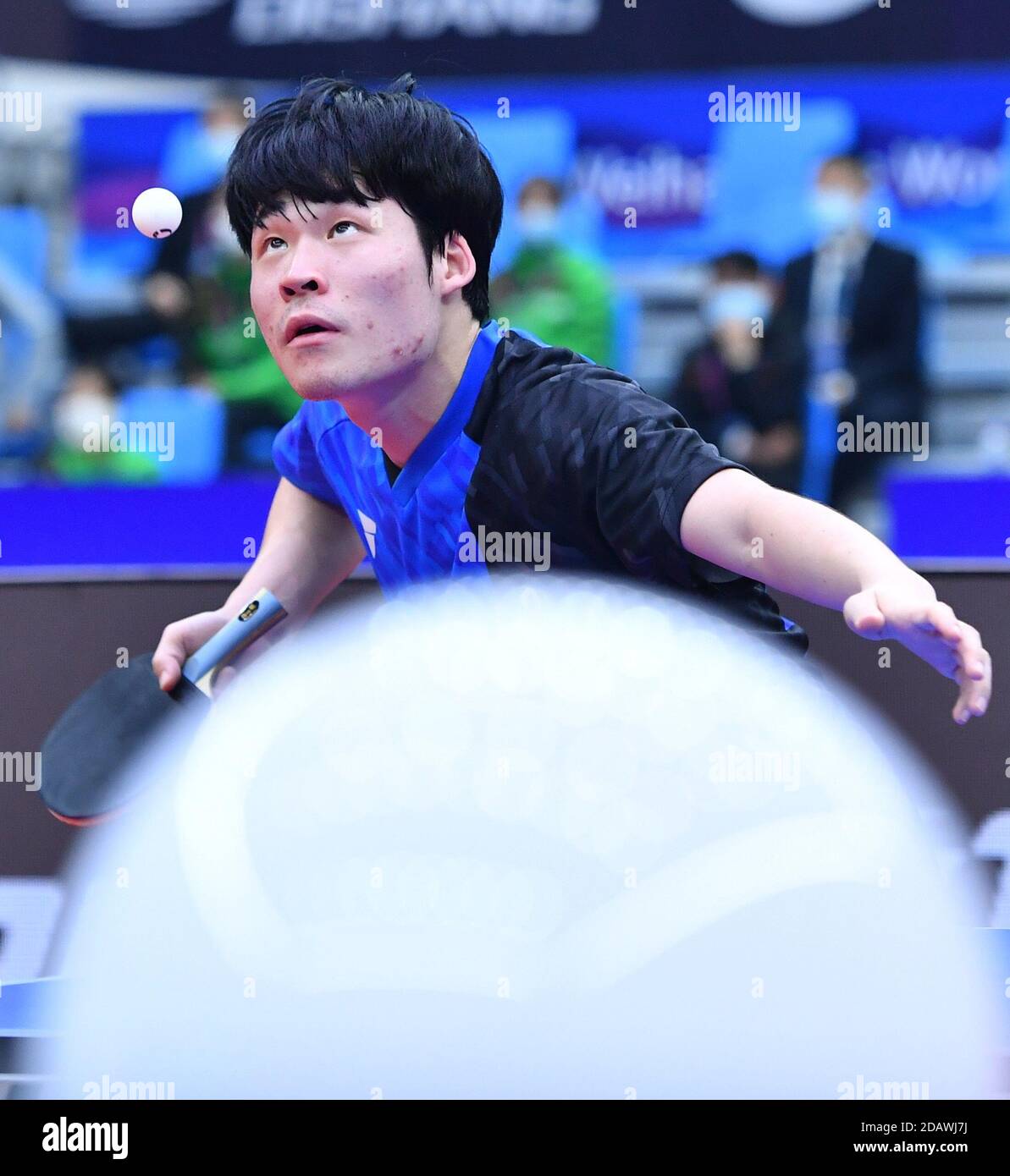 Weihai, China's Shandong Province. 15th Nov, 2020. Jang Woojin of South Korea serves during the ...