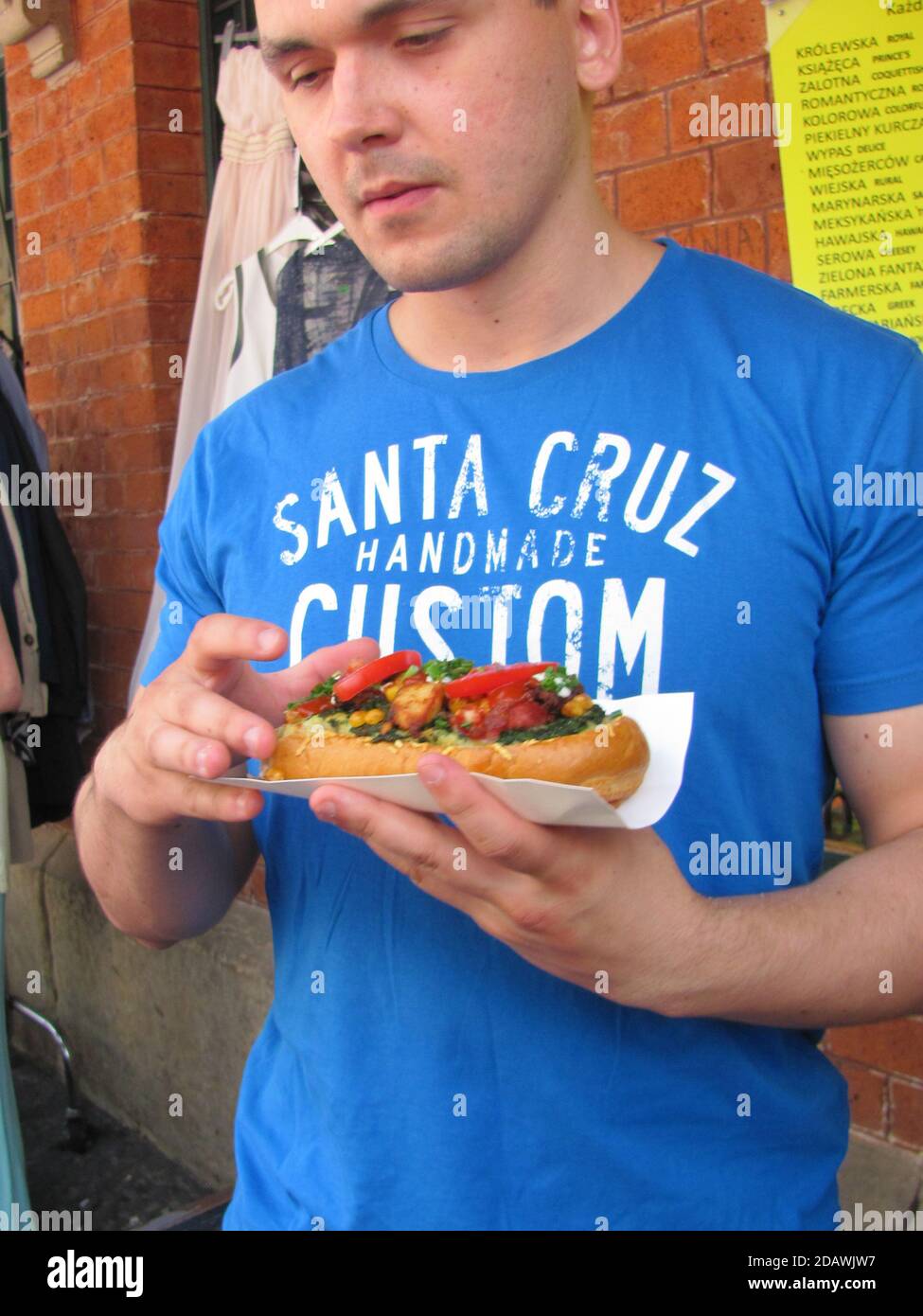 Guests eat Zapiekanka, a Polish fast food. The classic zapiekanka is ...