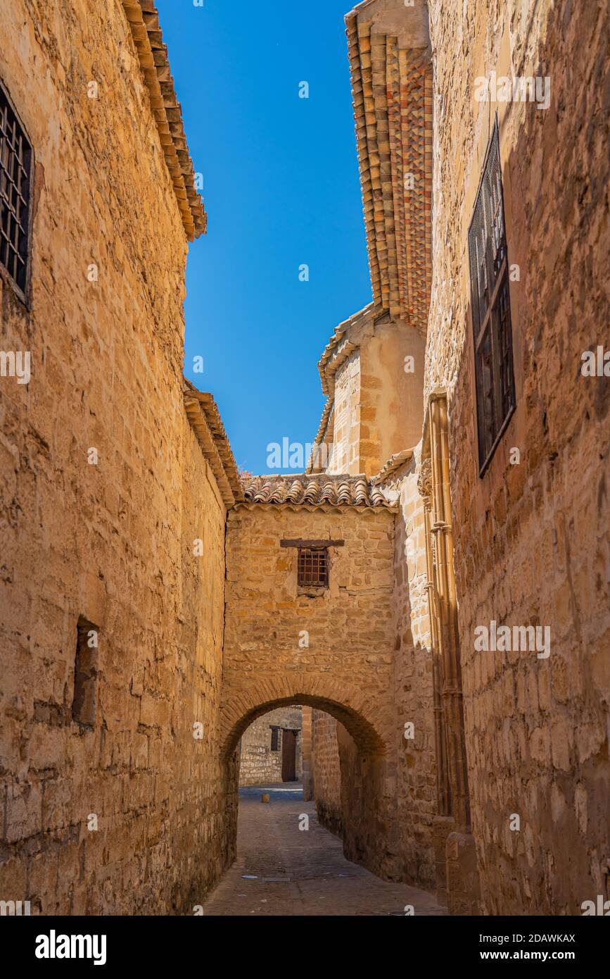 Old stoned alley in Baeza medieval city, declared along with Ubeda as ...