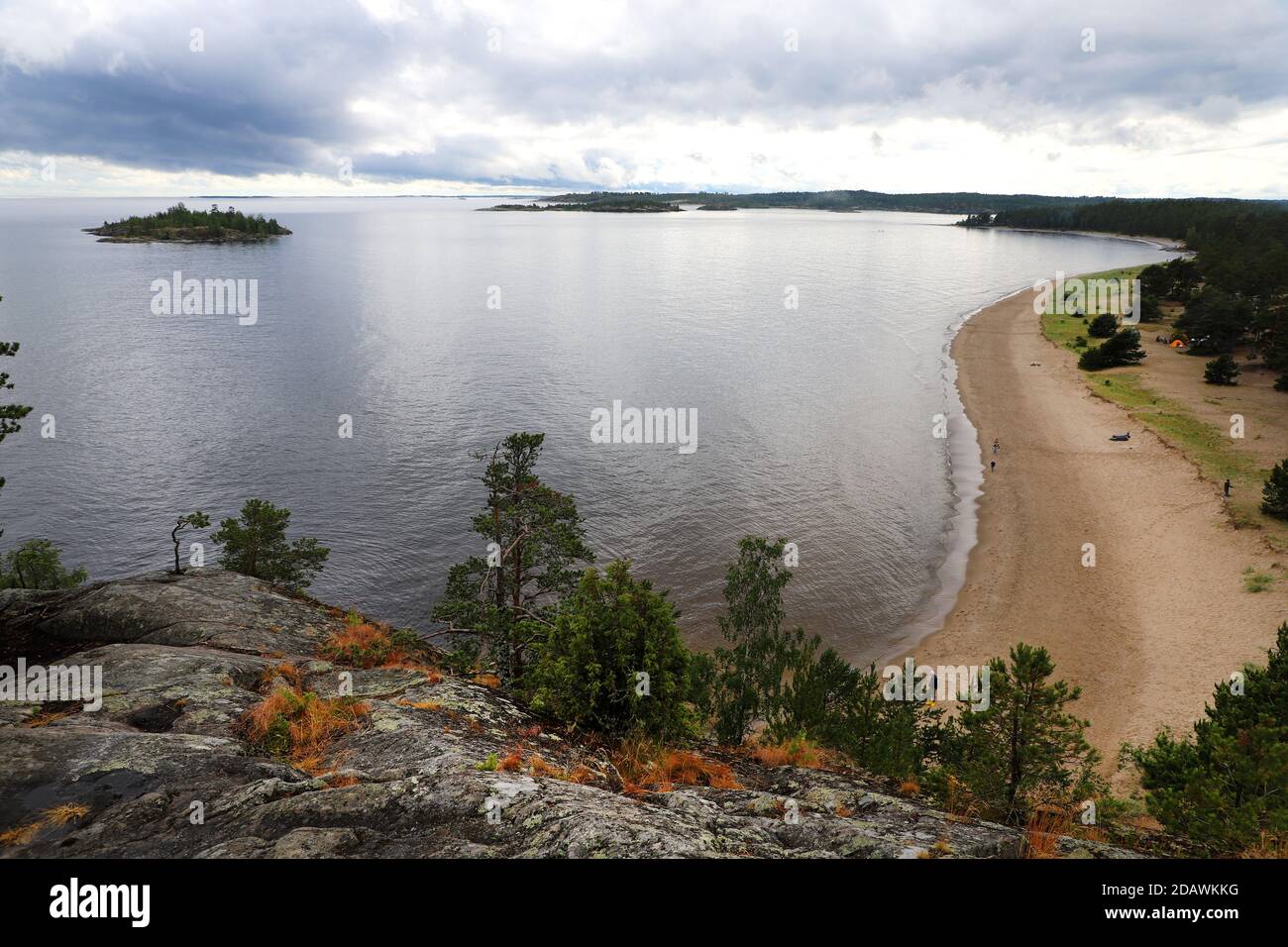 Beautiful lakeshore shoot from a high cliff and cloudy sky. Nature ...