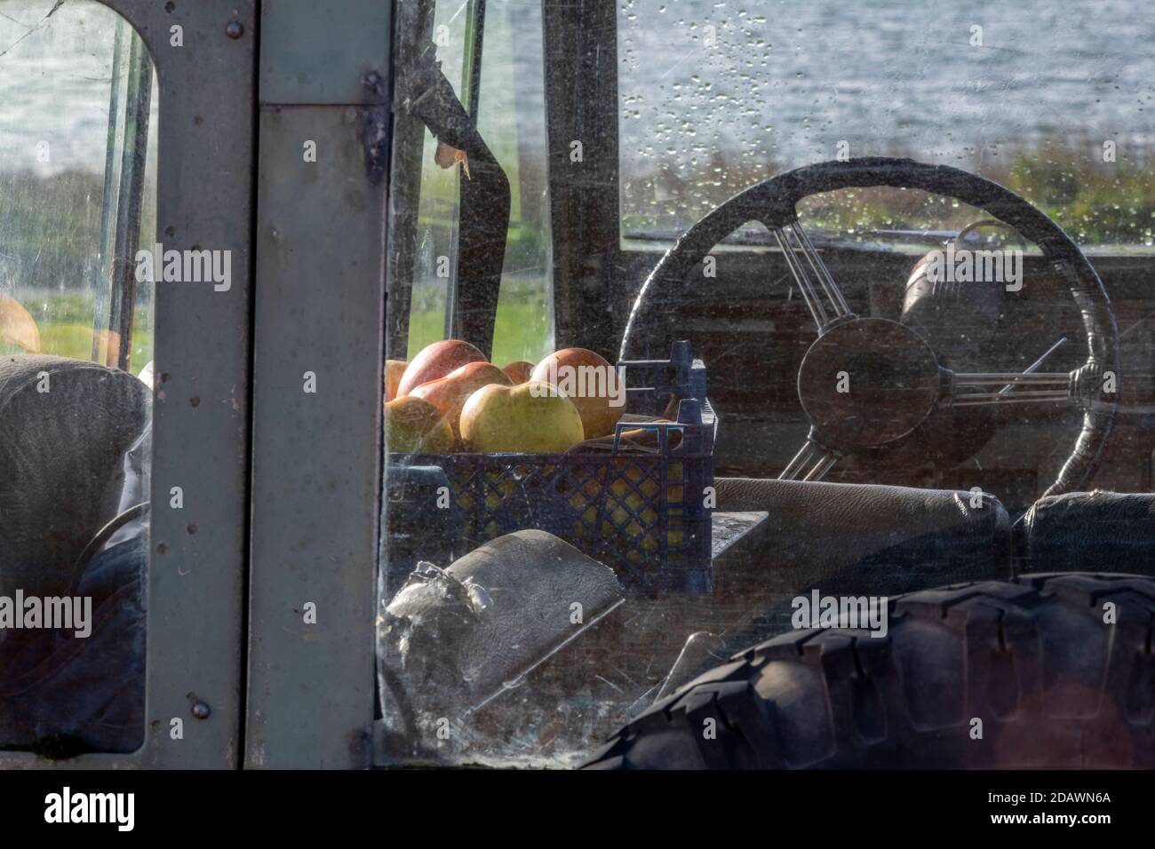an old fashioned land rover car with freshly picked apples inside on ...