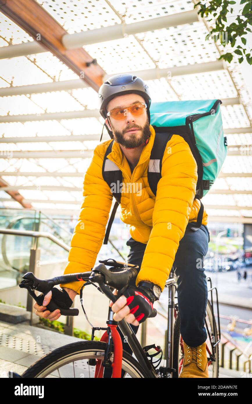 Food delivery service, rider delivering food to clints with bicycle ...