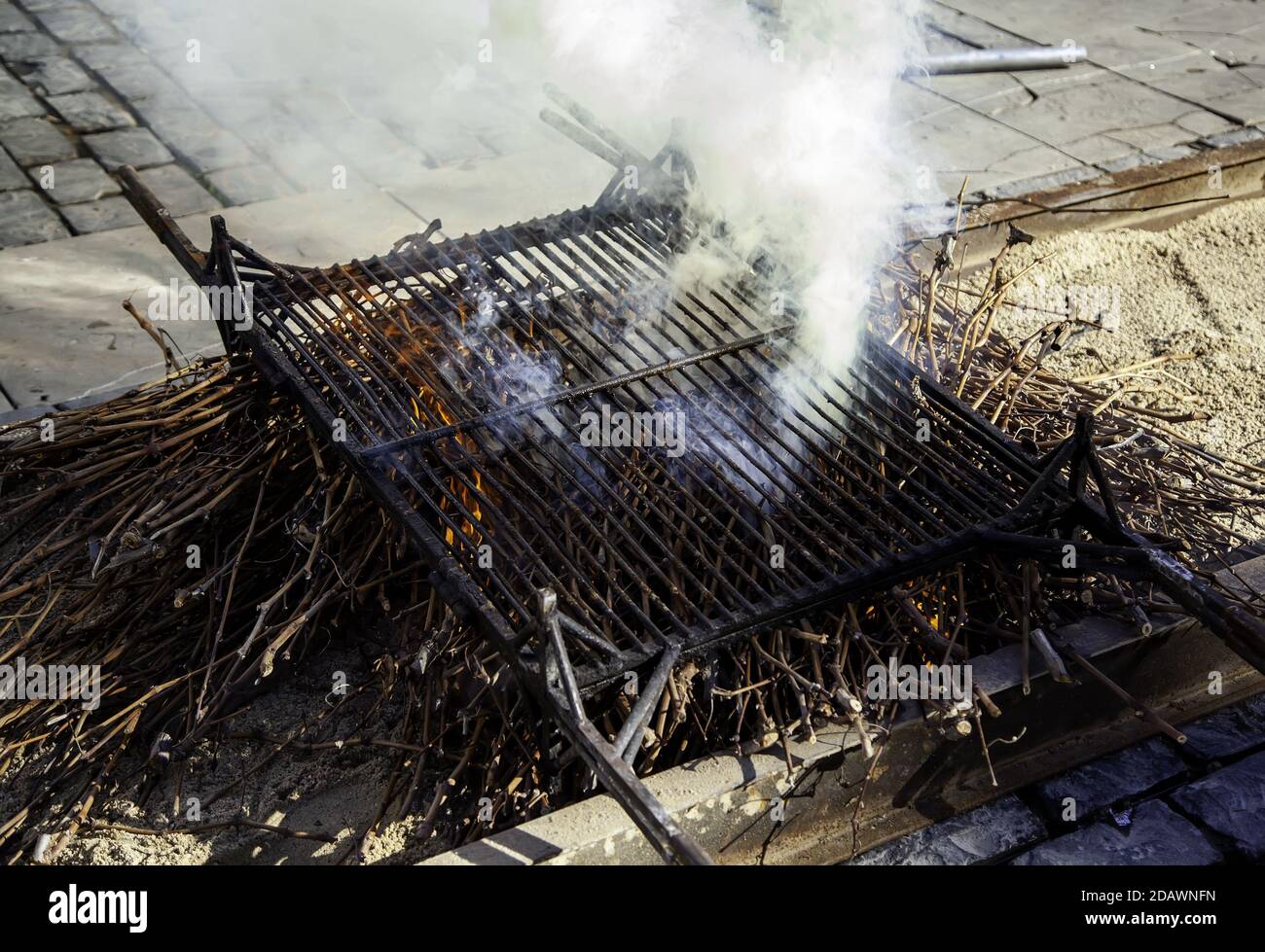 Fire on metal grill, barbecue and cookout Stock Photo - Alamy