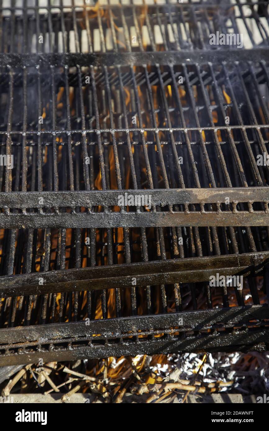 Fire on metal grill, barbecue and cookout Stock Photo - Alamy