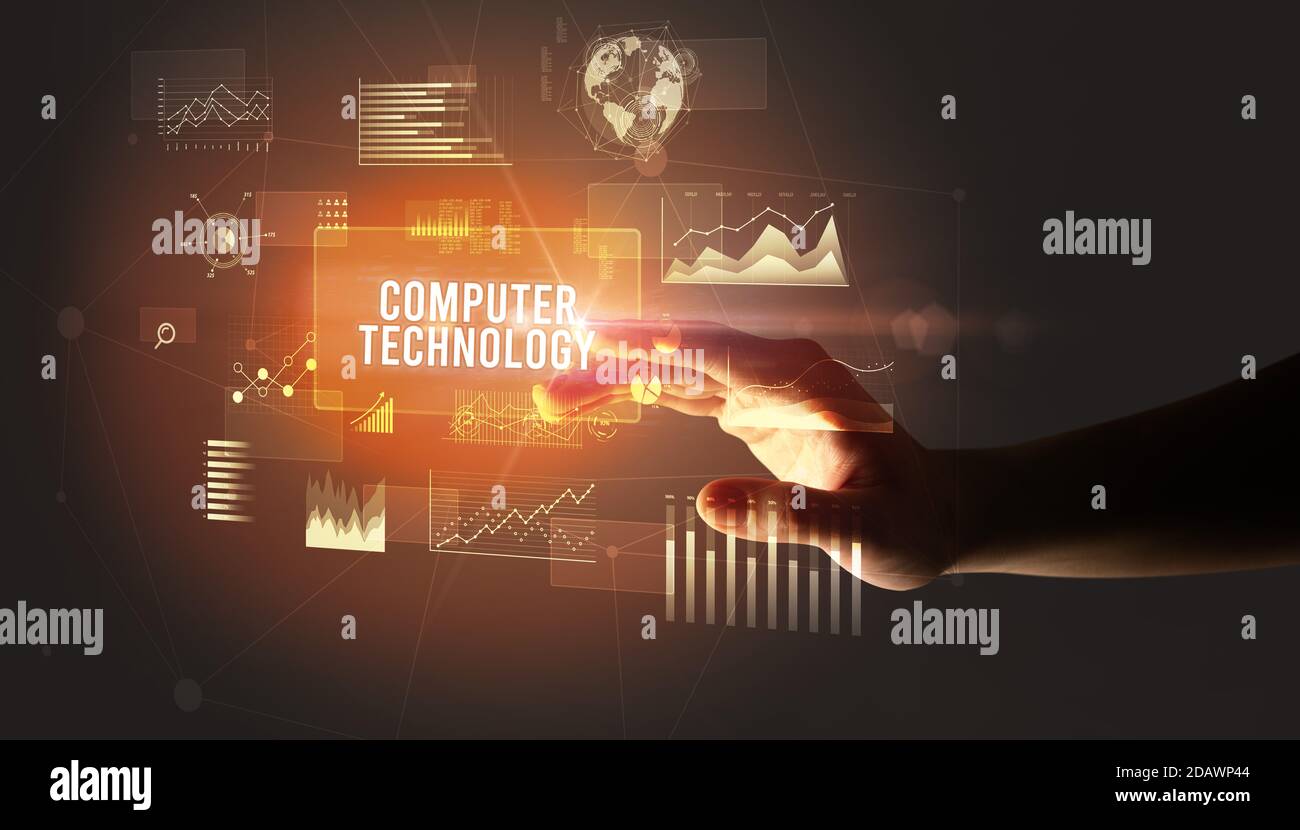 Hand touching COMPUTER TECHNOLOGY inscription, new business technology ...