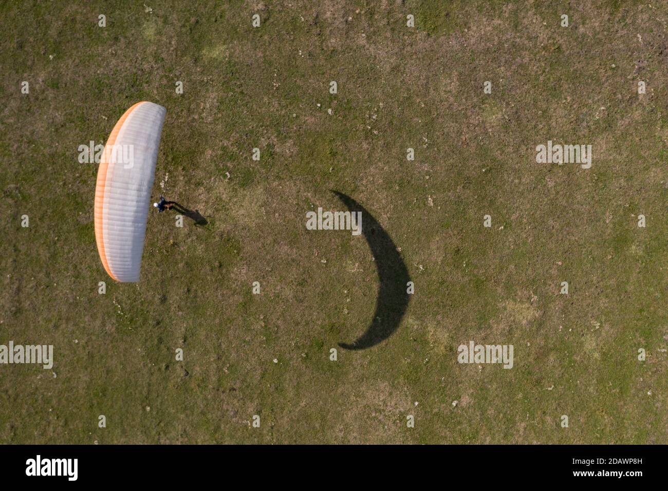 Paraglider top view, he learns to fly on a plane field. Gliding School ...