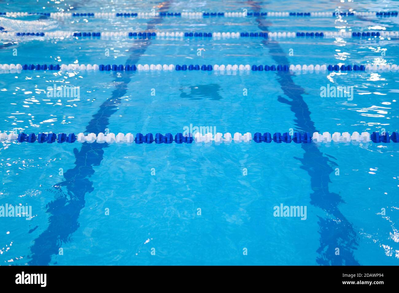 background - fragment of the competition pool with blue water and ...