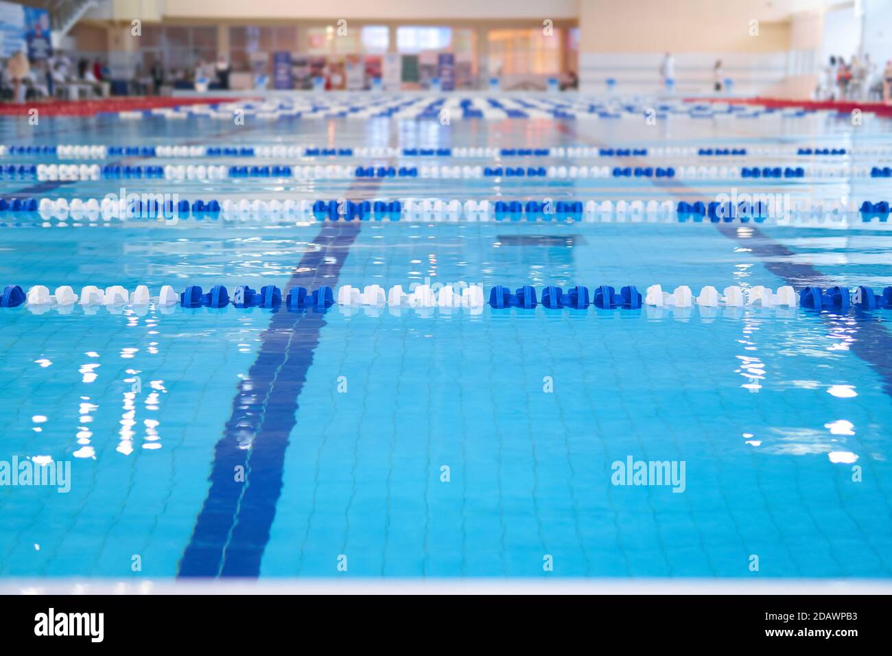 background - fragment of the competition pool with blue water and ...