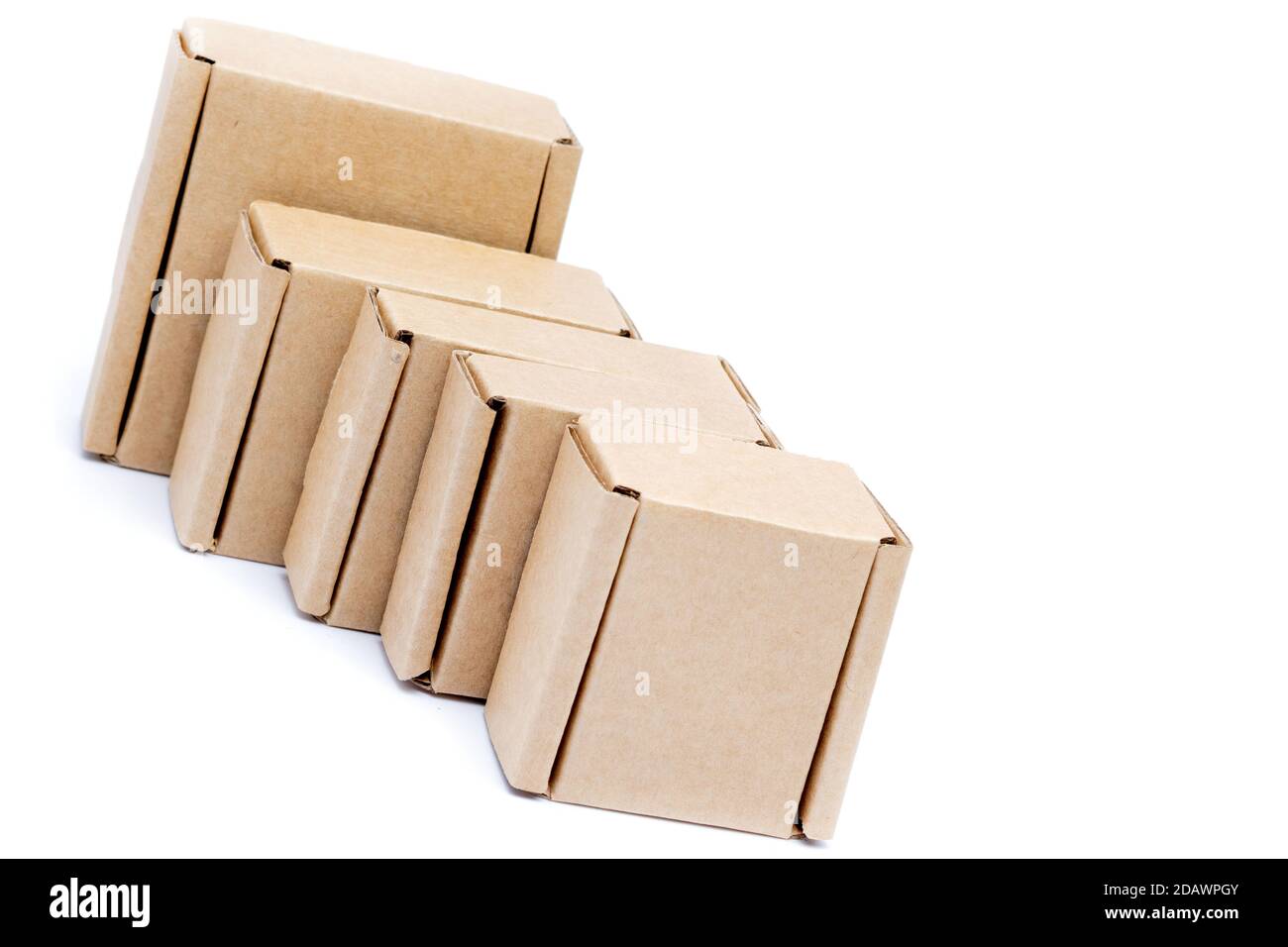 Cardboard boxes of various sizes are arranged in a row diagonally ...