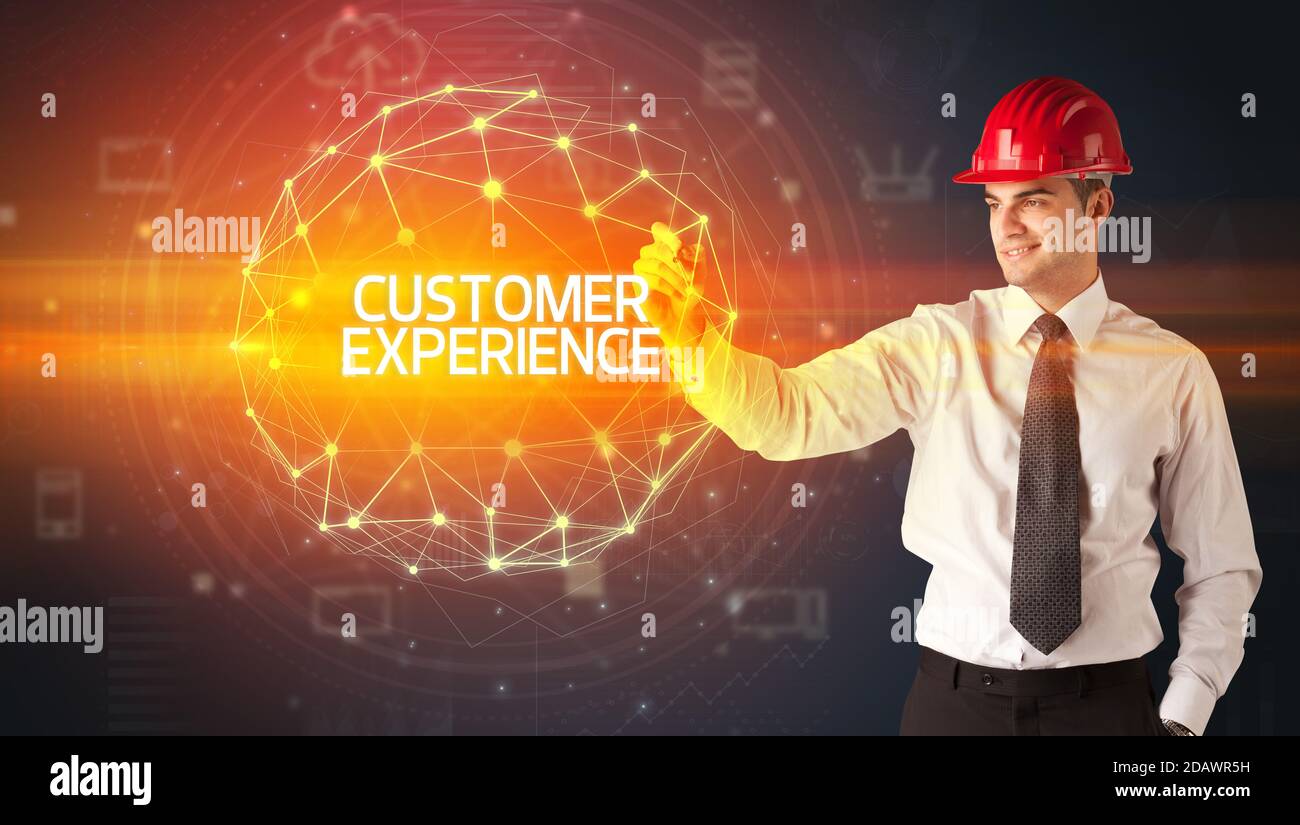 Handsome businessman with helmet drawing CUSTOMER EXPERIENCE ...