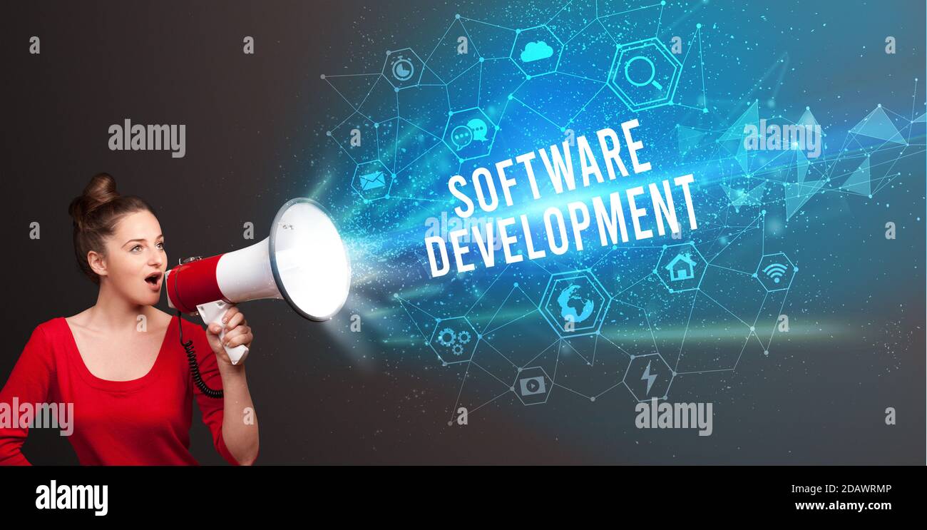 Young woman shouting in megaphone with SOFTWARE DEVELOPMENT inscription ...