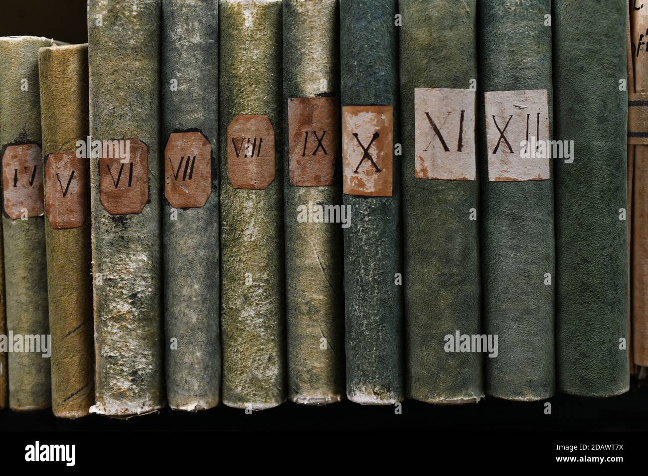 Old books with Roman numerals in the library Stock Photo - Alamy