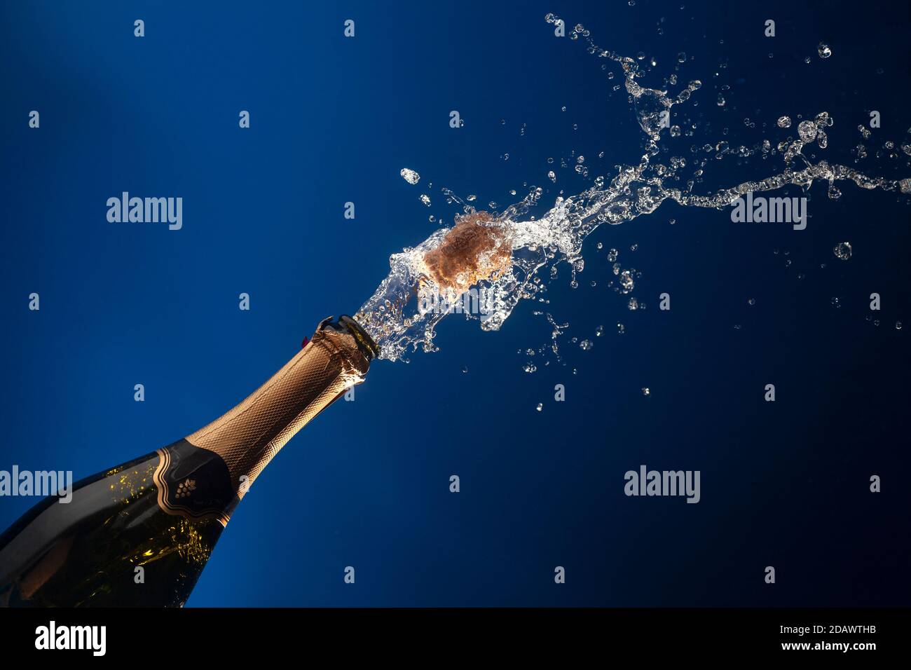 Celebration theme with splashing champagne Stock Photo - Alamy