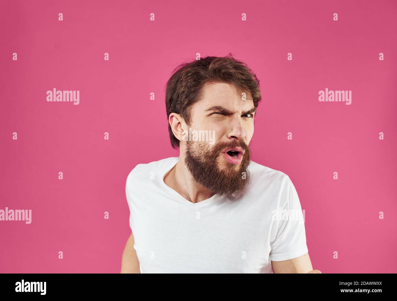 Angry man yells on pink background stress irritability model Stock ...