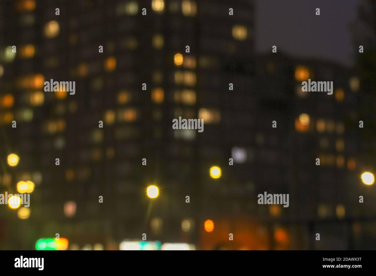 The facade of the apartment building, light in the windows in the ...