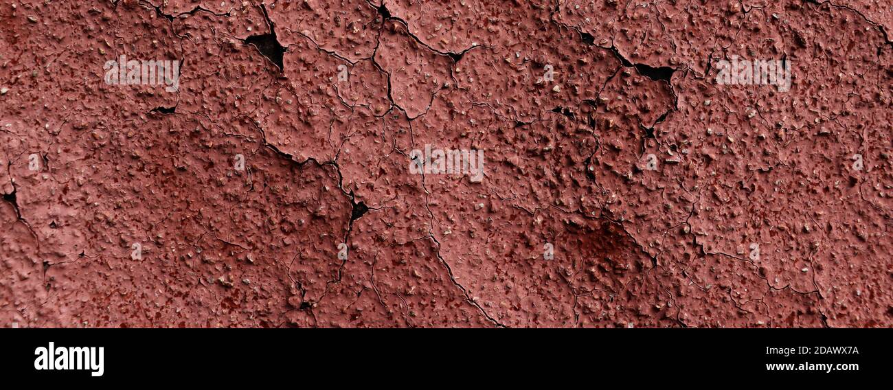 Abstract red old paint on wooden board. Red cracked wall bckground ...