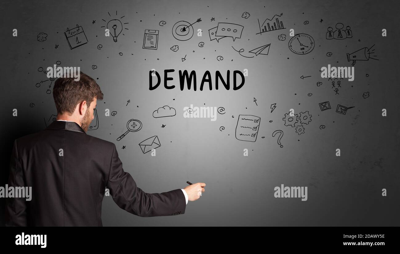 businessman drawing a creative idea sketch with DEMAND inscription ...