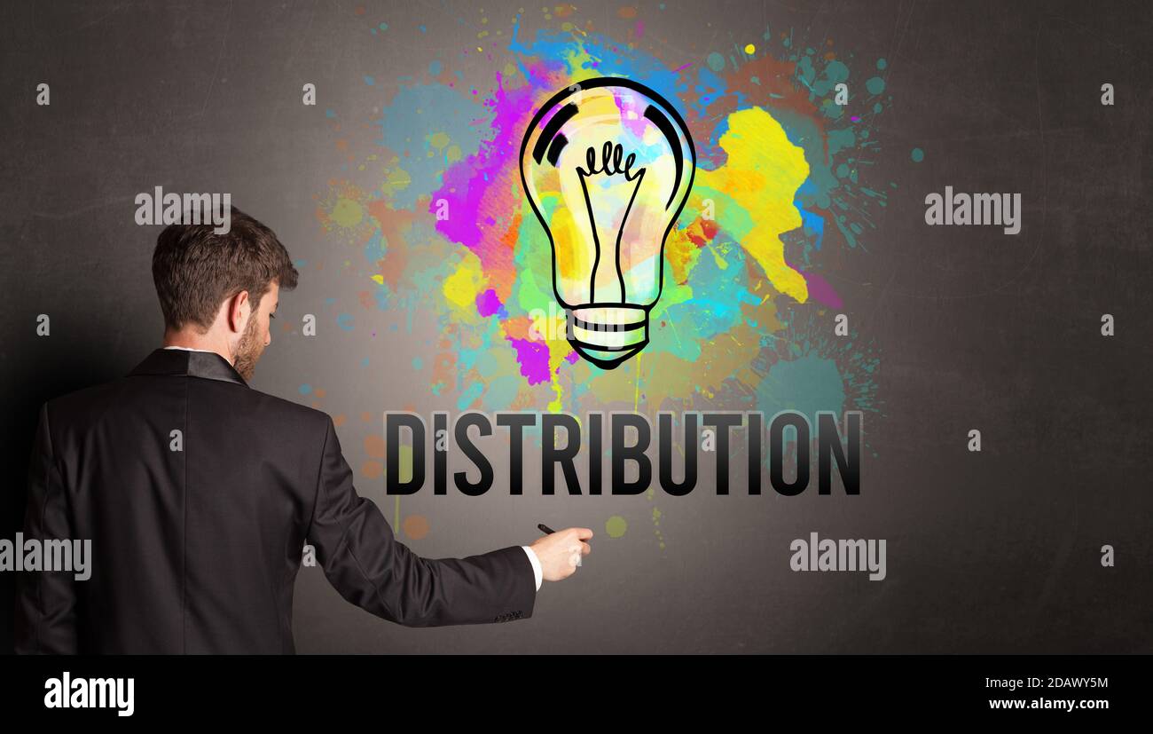 businessman drawing colorful light bulb with DISTRIBUTION inscription ...
