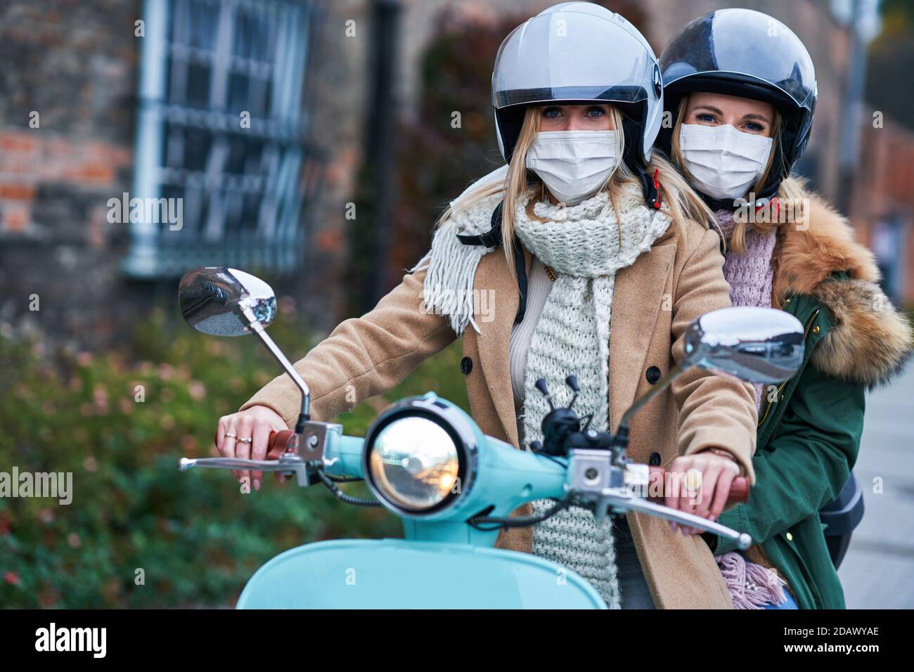 Protective masks ride scooters hi-res stock photography and images - Alamy