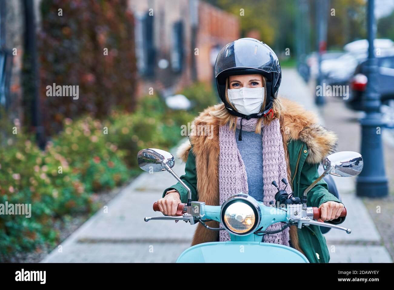 Protective masks ride scooters hi-res stock photography and images - Alamy