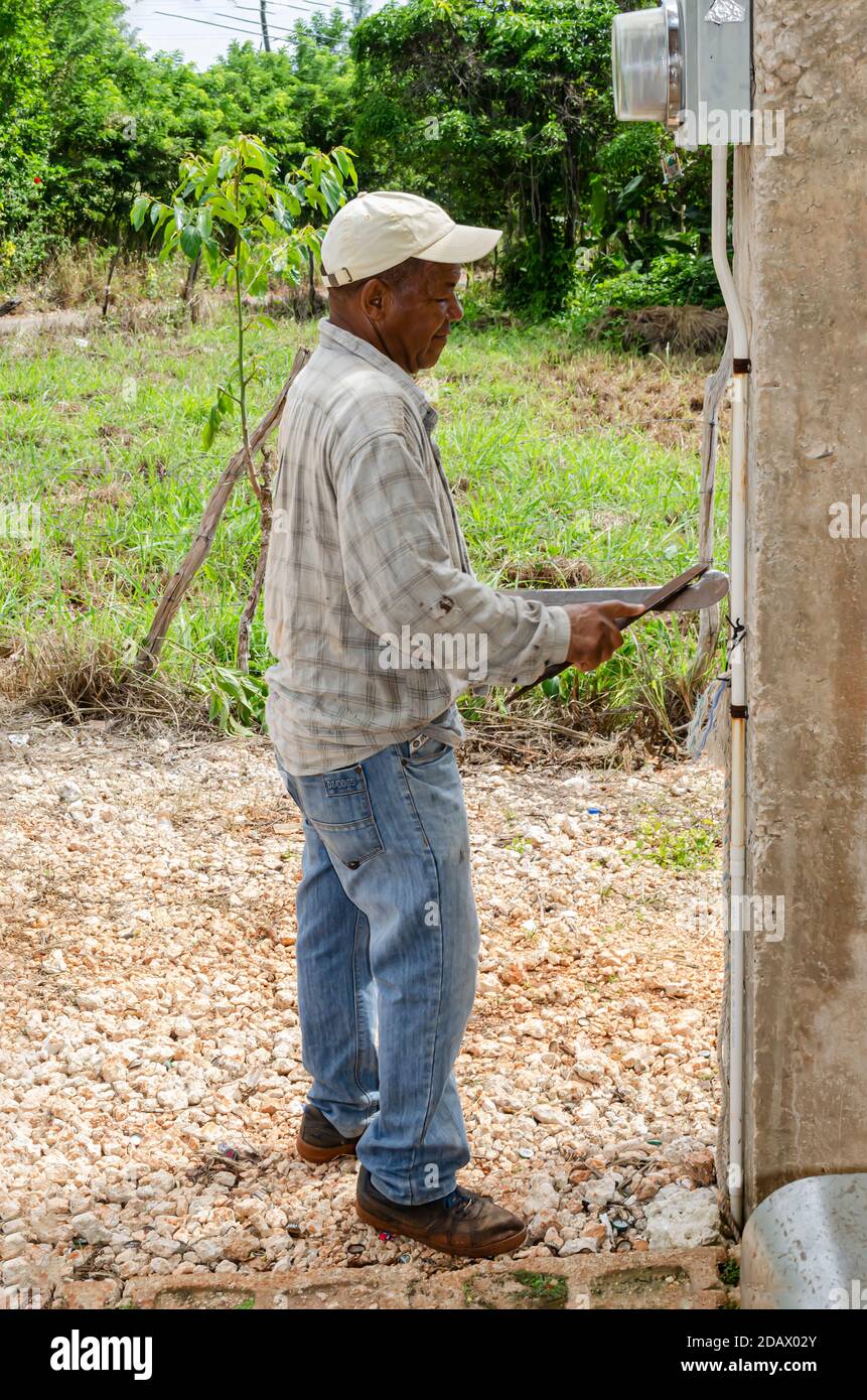With Back Turn Sharpening Machete Stock Photo - Alamy