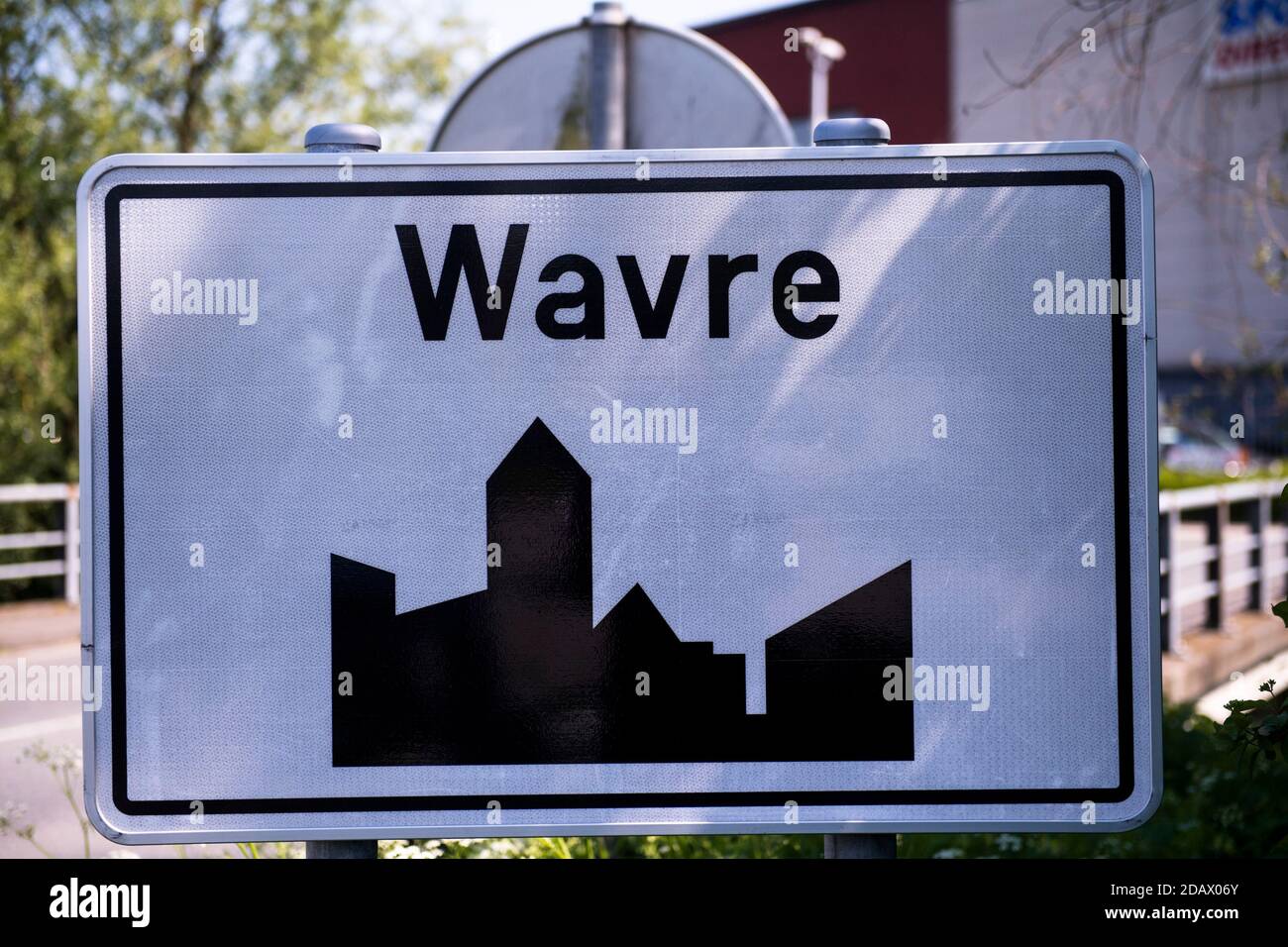 Illustration shows the name of the Wavre municipality on a road sign ...