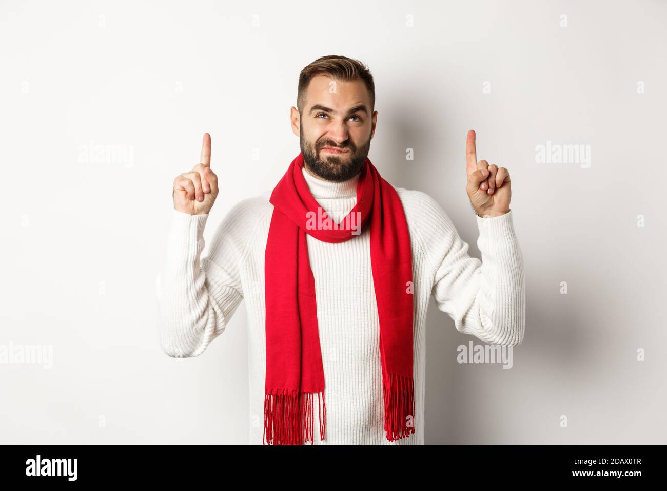 Christmas shopping and winter holidays concept. Disappointed guy ...