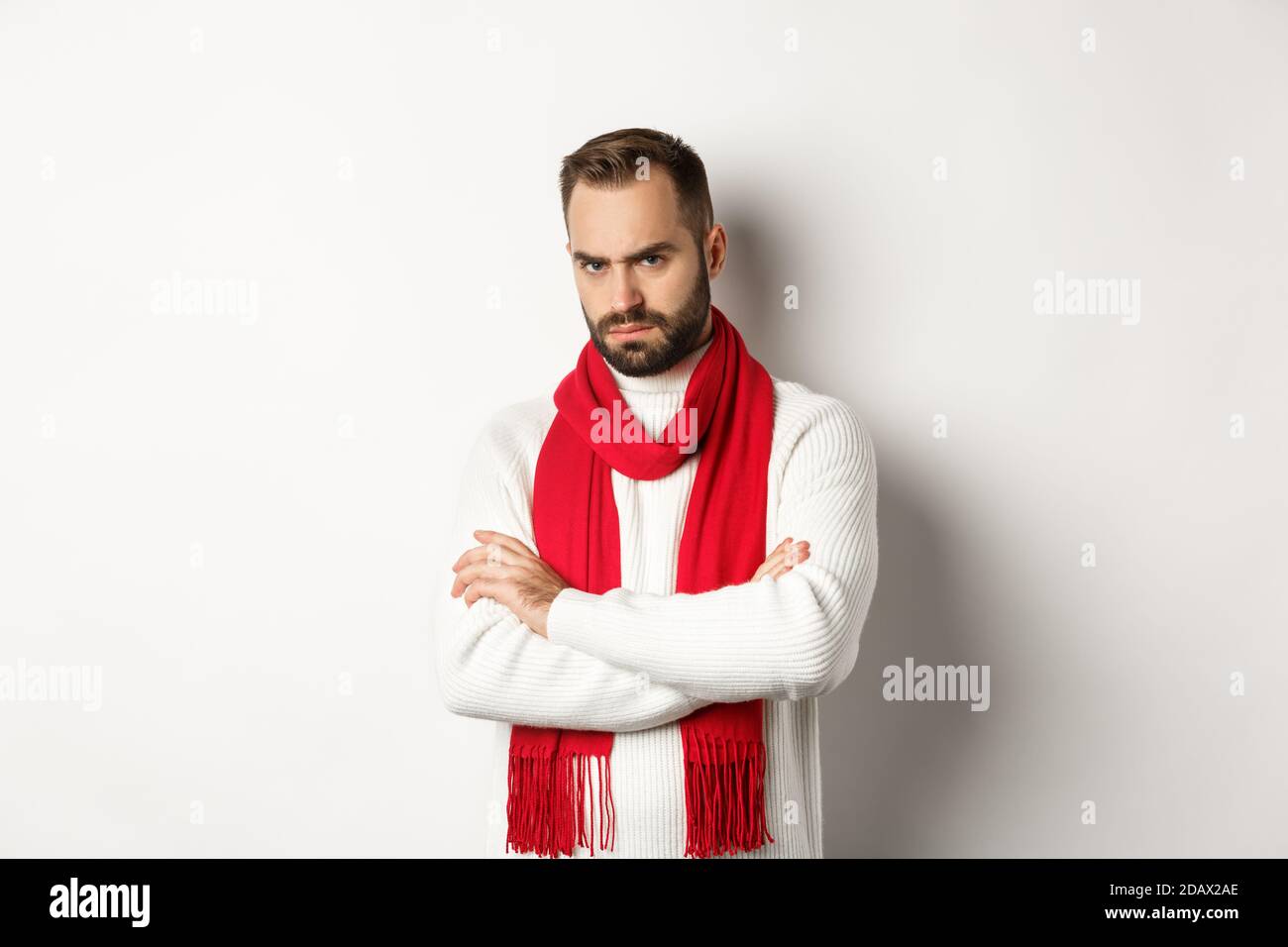 Bearded man looking angry and offended at you, cross arms on chest in ...
