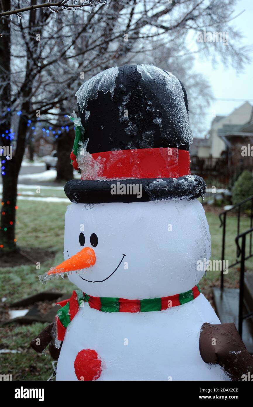 Aftermath of an ice storm on an inflatable snowman Stock Photo - Alamy