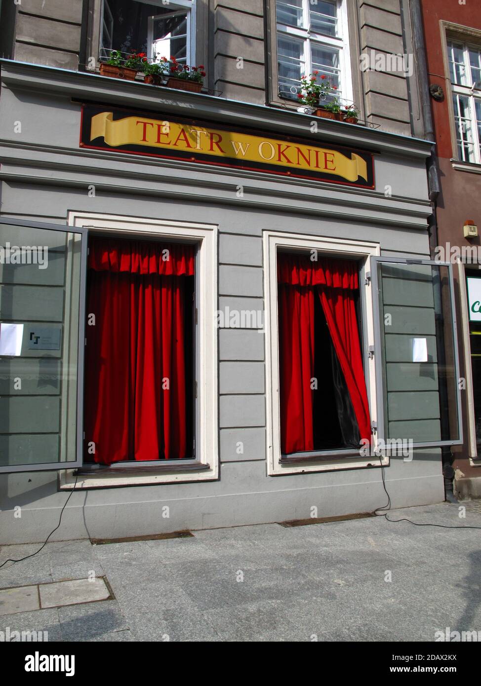 The street theater stage is in the window openings Stock Photo - Alamy