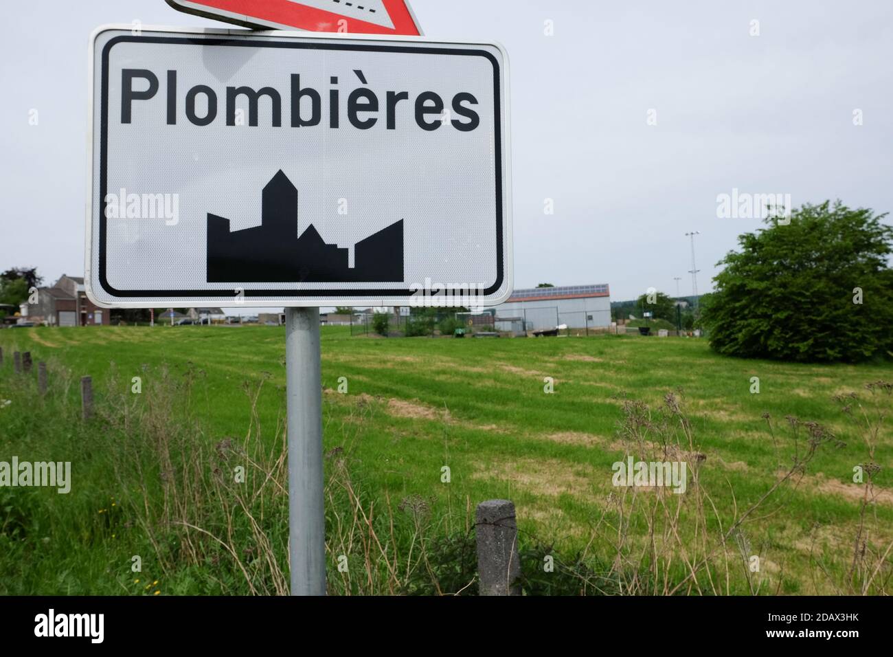 Illustration shows the name of the Plombieres municipality on a road ...