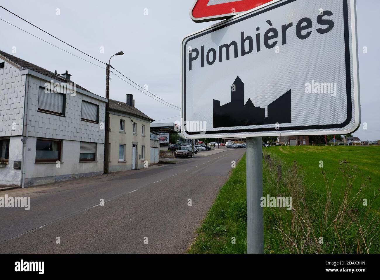 Illustration shows the name of the Plombieres municipality on a road ...