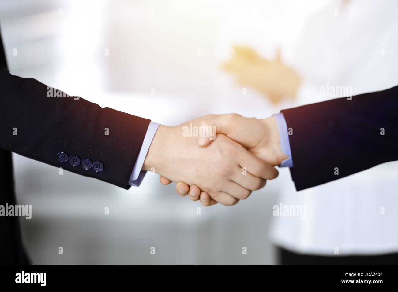 Business people shaking hands at meeting or negotiation, close-up ...