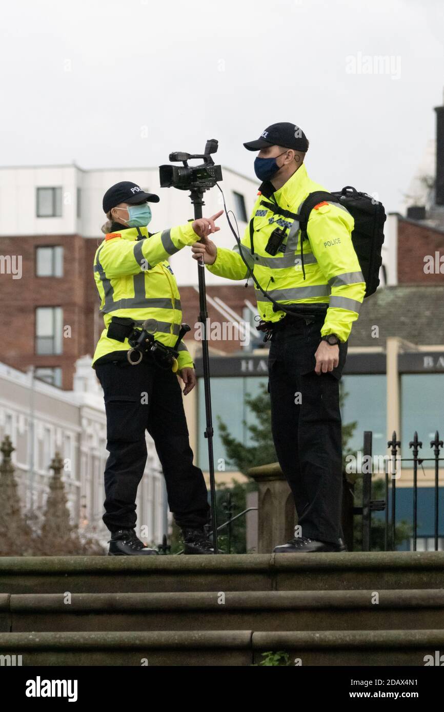 Berry Street, Liverpool, 14th Nov 2020. Two police officers (evidence ...