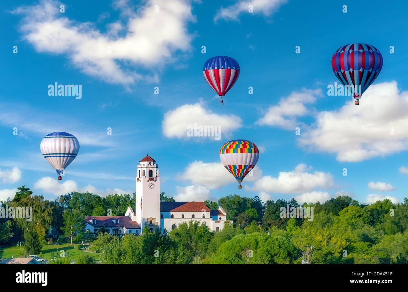 Colorful balloons in the sky over a train depot Stock Photo - Alamy