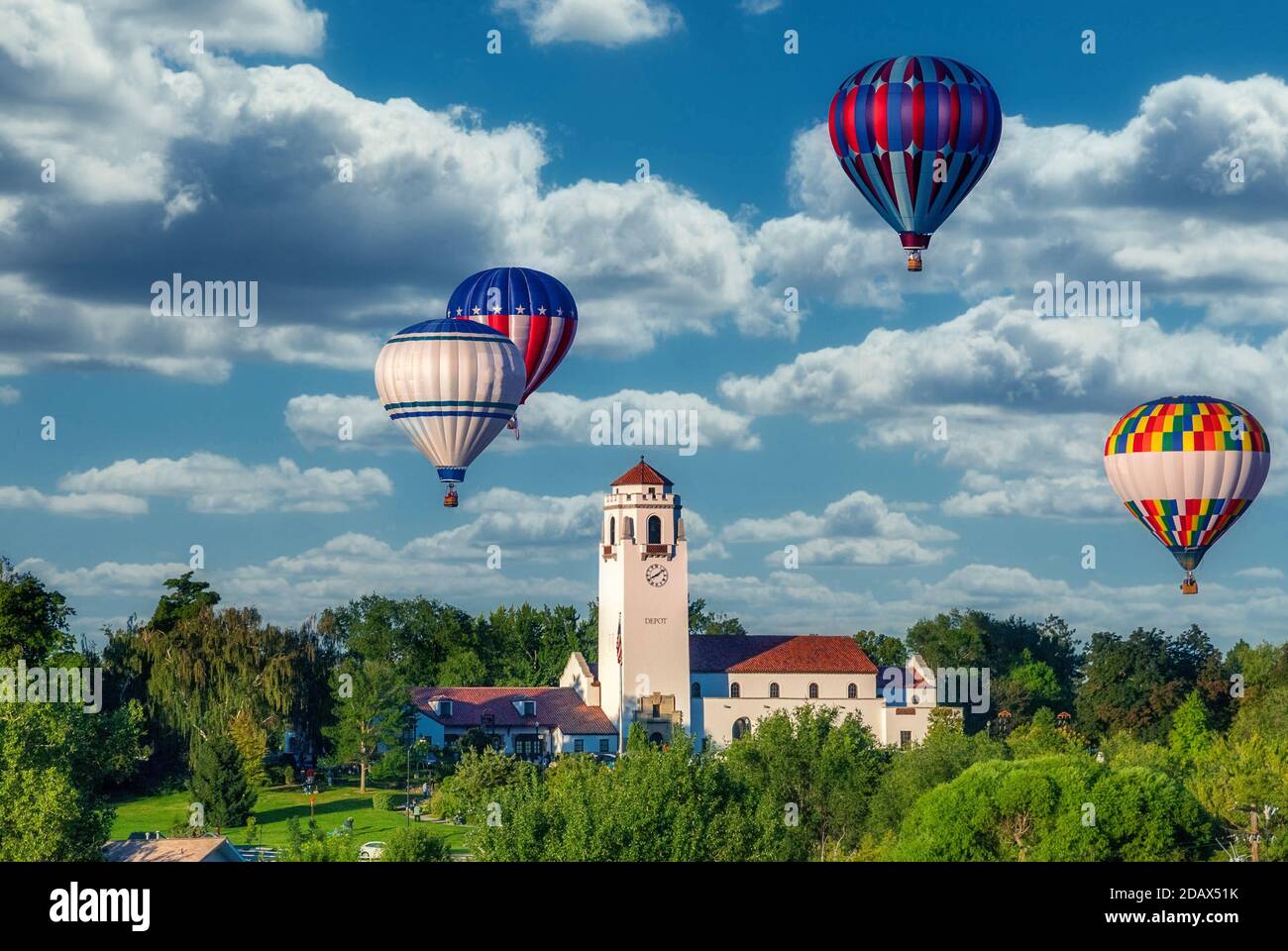 Clock tower of a local train depot with Hot Air Balloons Stock Photo ...
