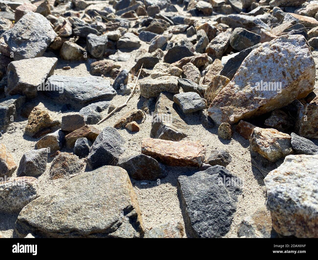 large flat sand stone rocks perspective view with deep shadows and ...