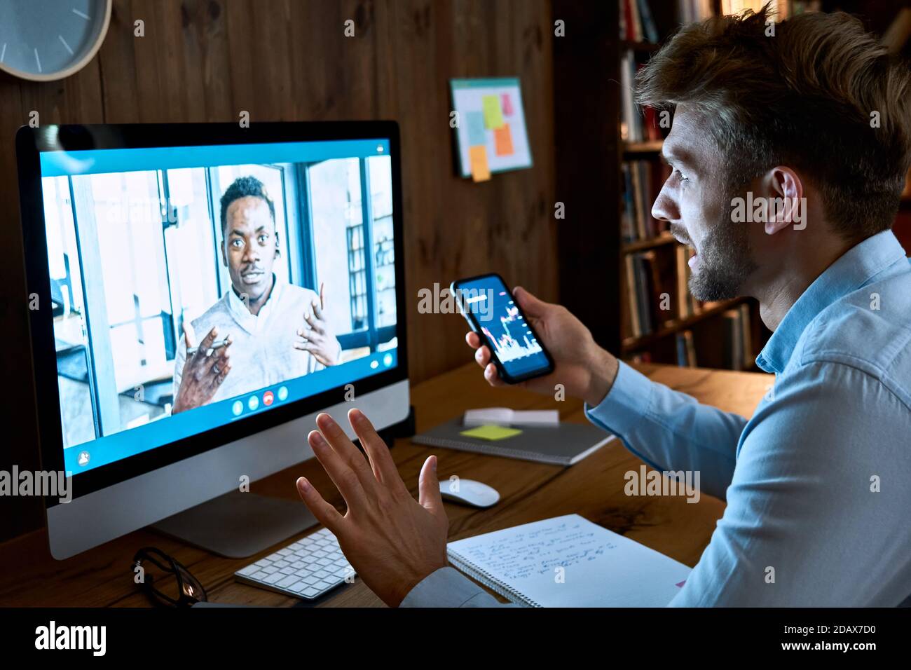 Caucasian financial advisor consulting african client on video ...