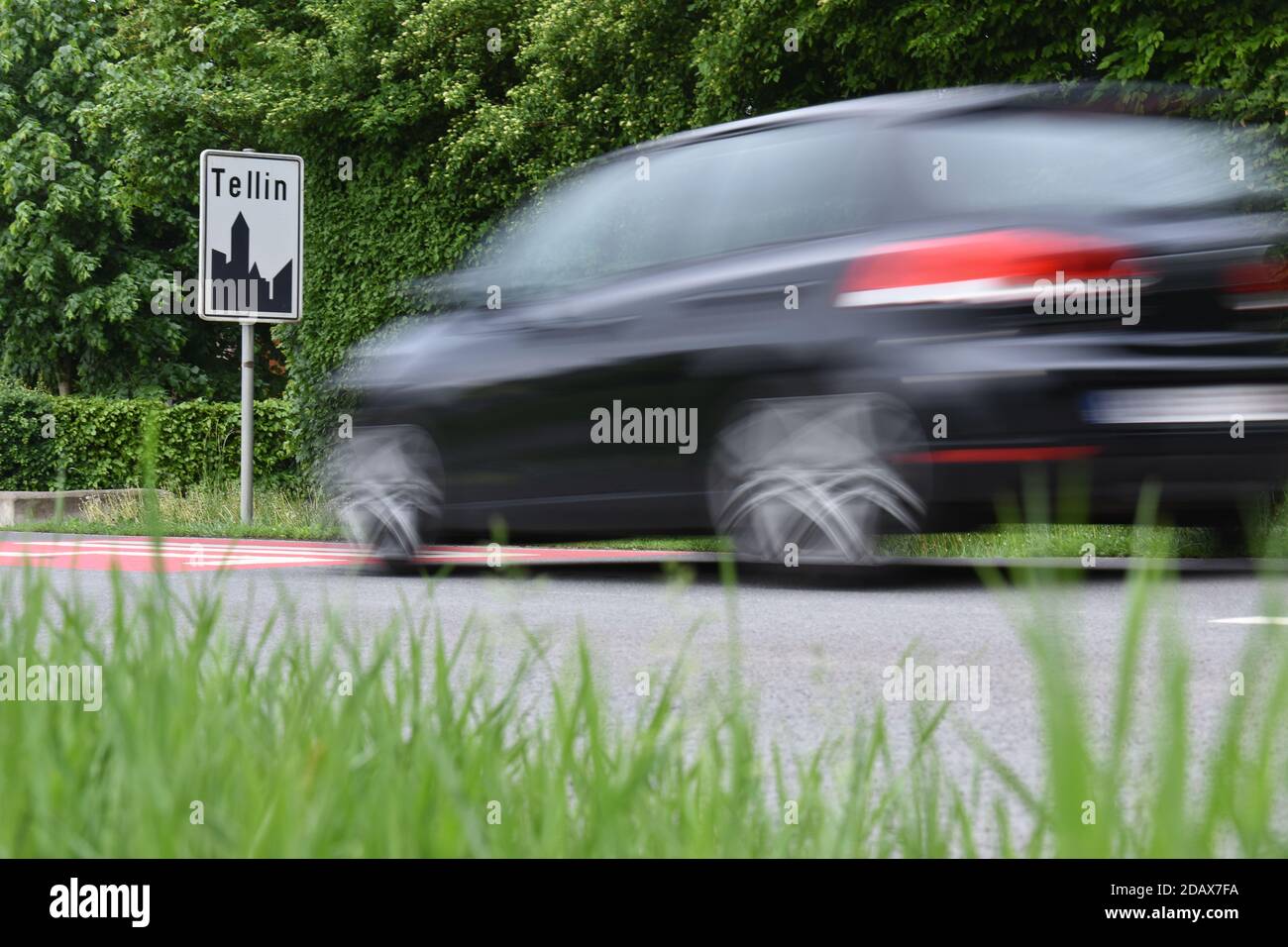 Illustration shows the name of the Tellin municipality on a road sign ...