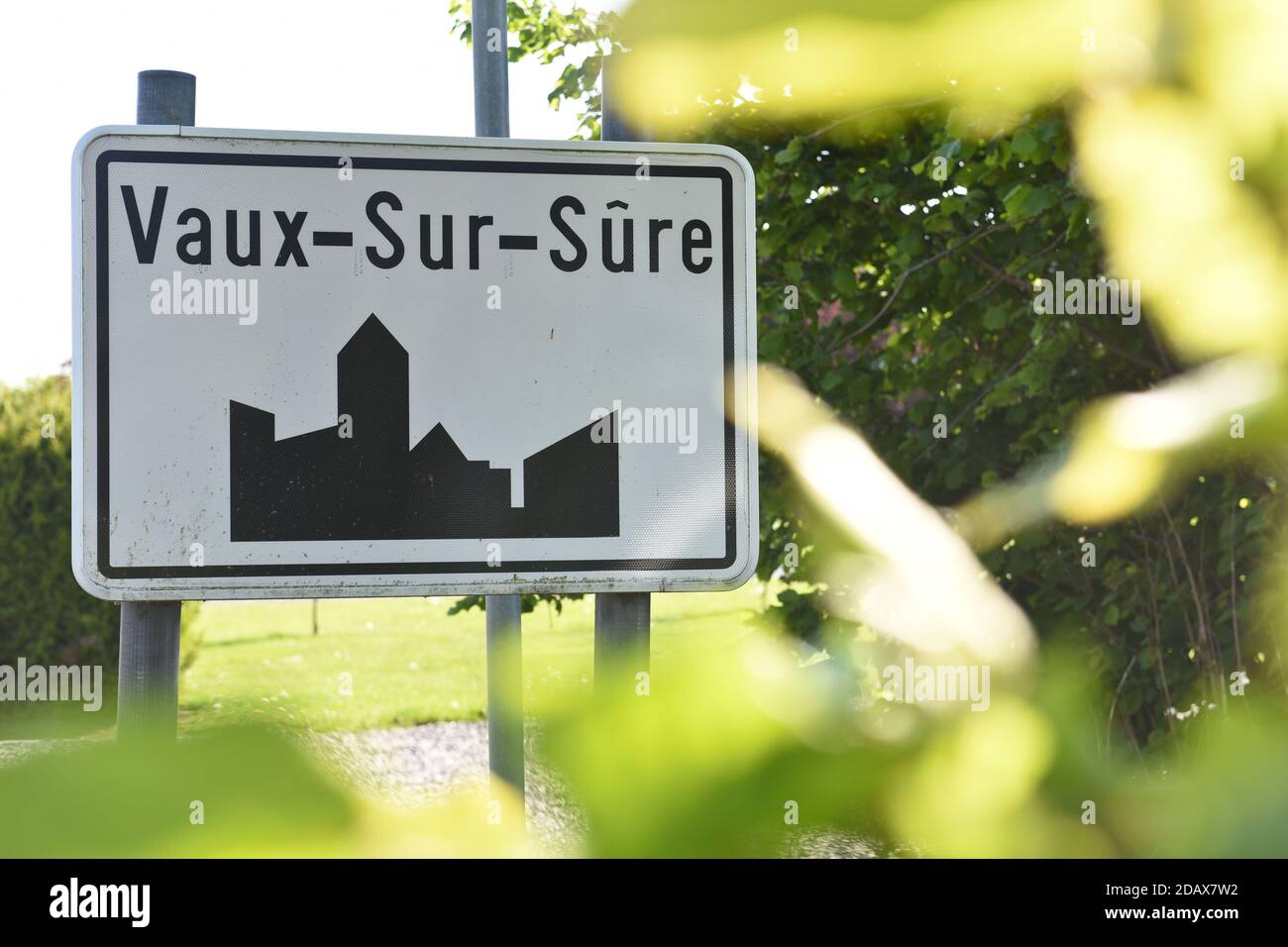 Illustration shows the name of the Vaux-Sur-Sure municipality on a road ...