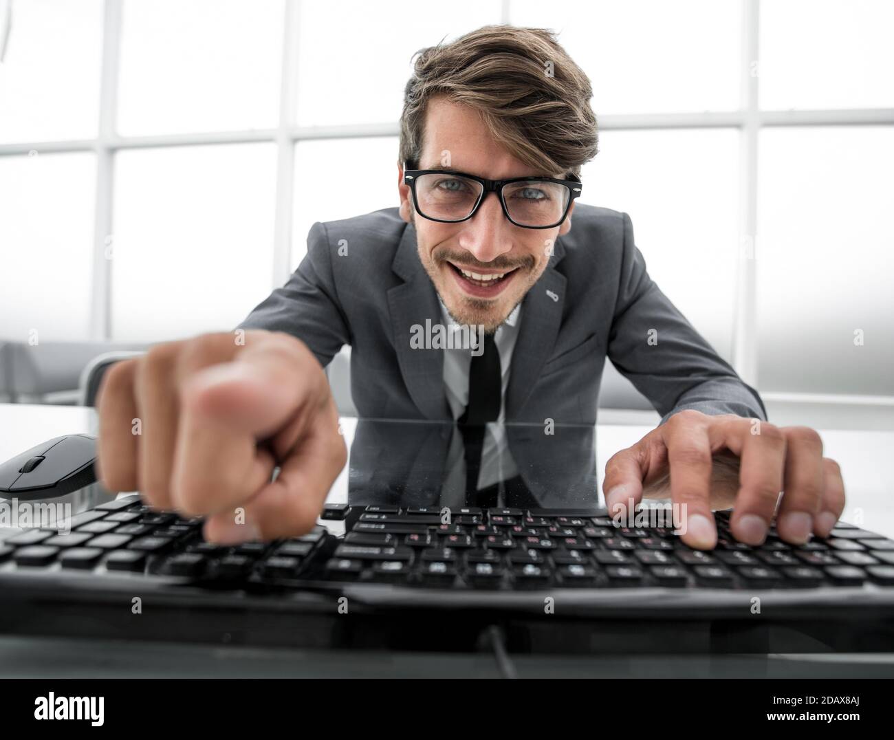 man pointing at something with finger and using computer keyboard Stock ...