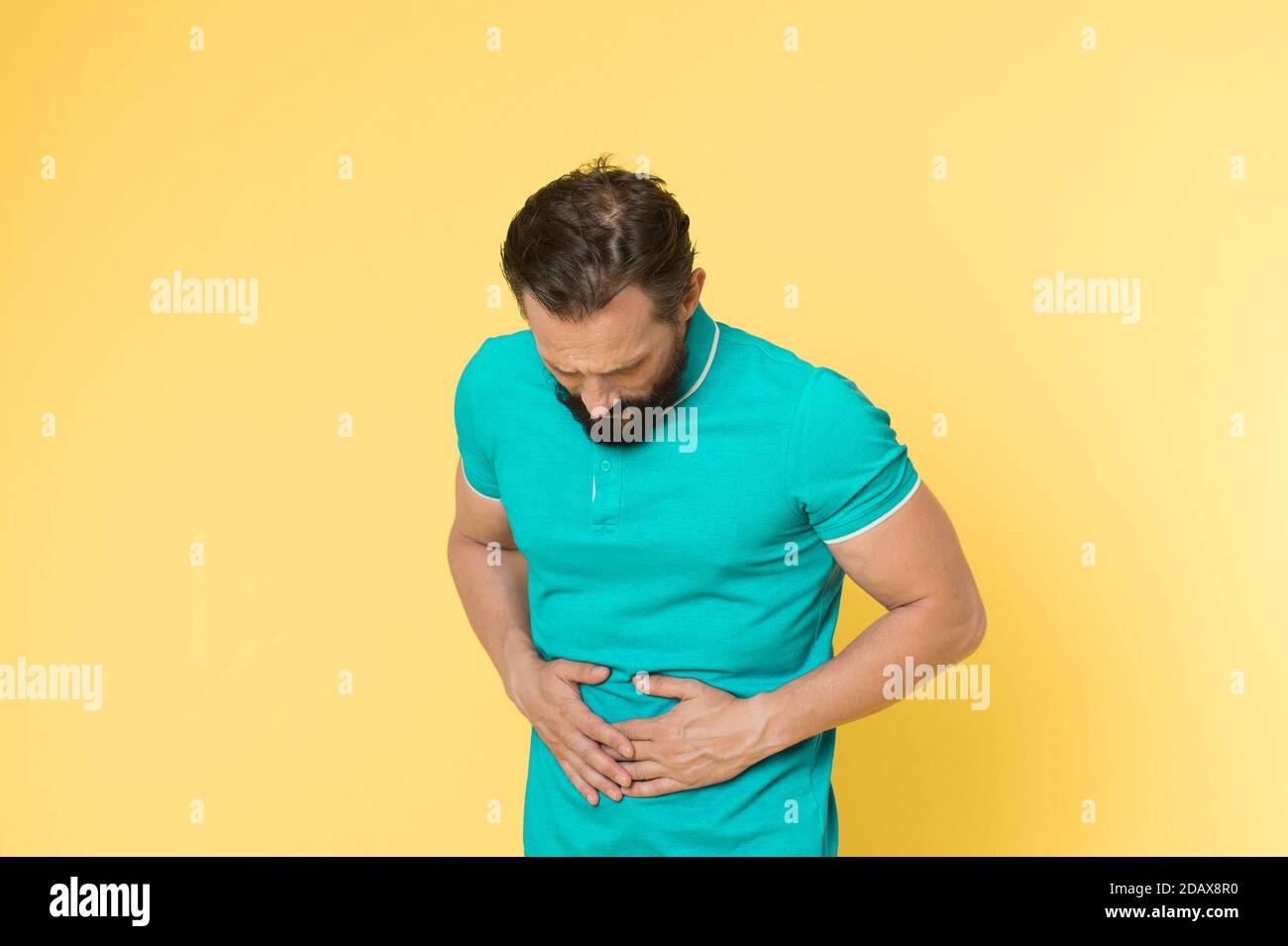 Sore stomach is killing me. Sick man suffer from stomach ache ...