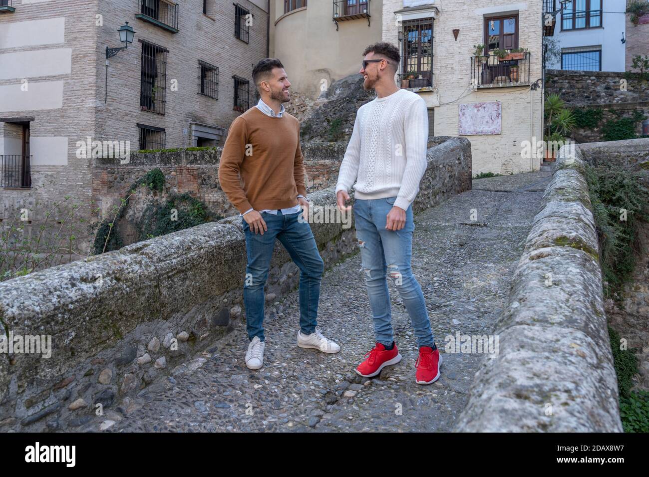Two friends talking on bridge hi-res stock photography and images - Alamy