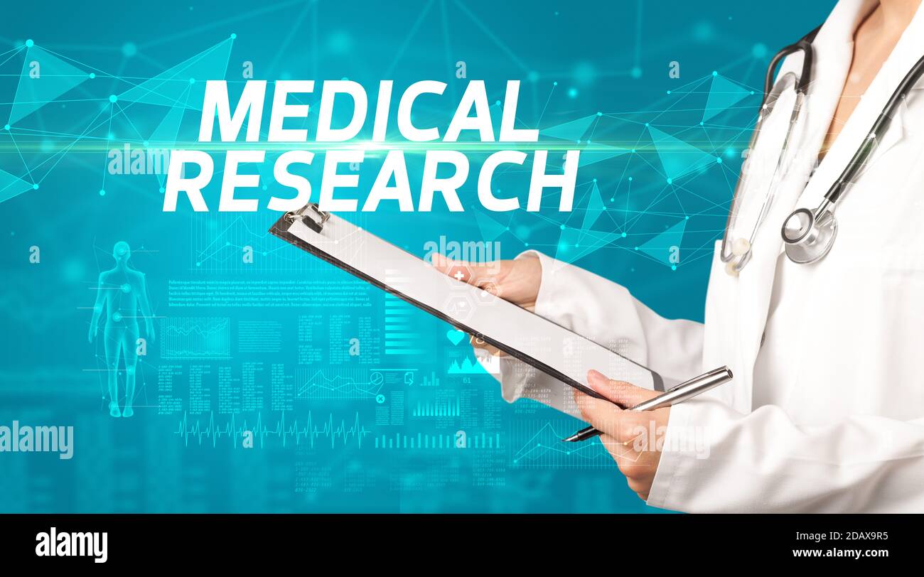 doctor writes notes on the clipboard with MEDICAL RESEARCH inscription ...