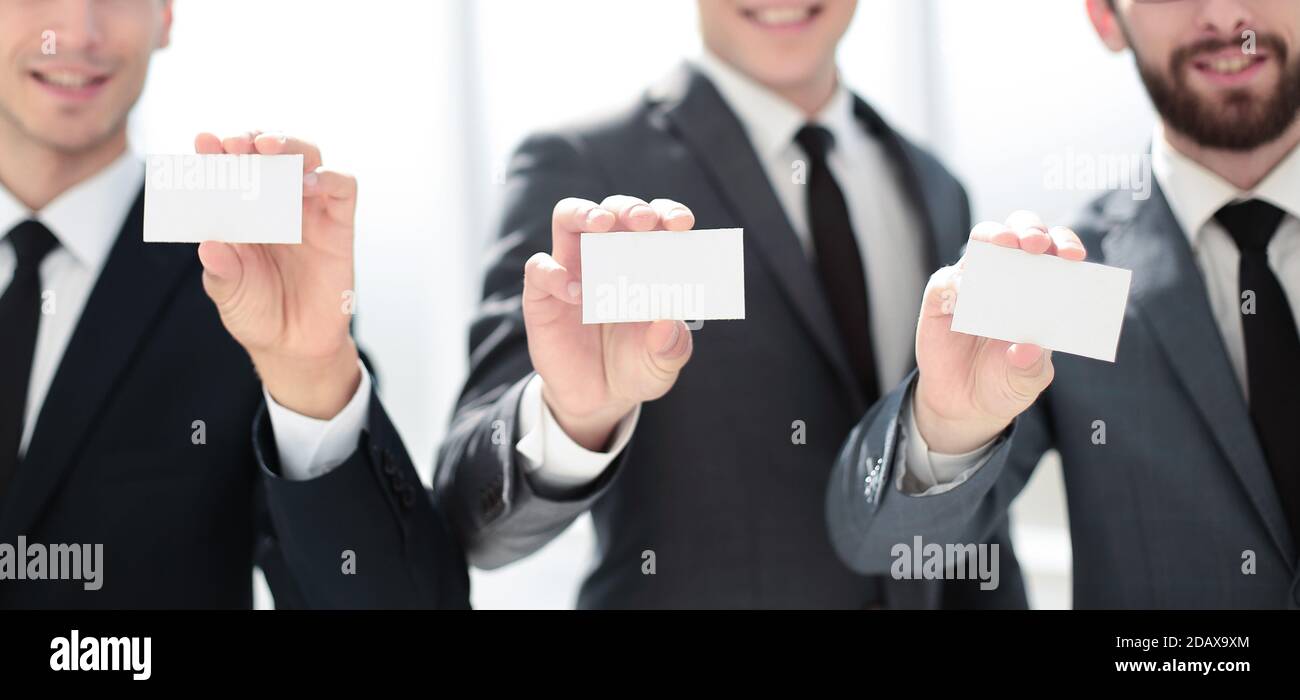 young business people showing their business card Stock Photo - Alamy
